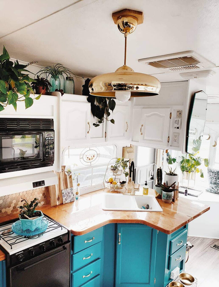 The interior of this 5th wheel is boho-glam and filled with plants ...